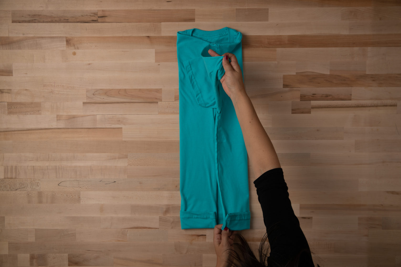 How to Pack Shirts for Travel (Step-By-Step) - Custom Ink Blog